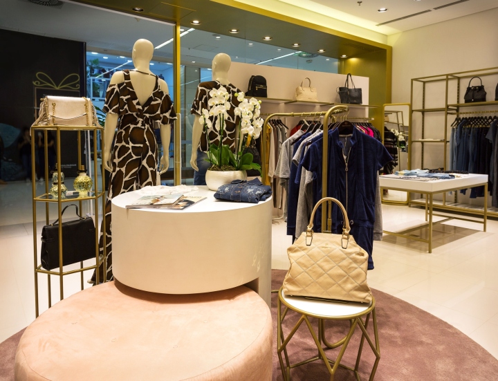 Wooden clothes display counter table design kids clothing store ...