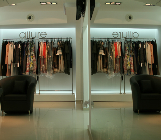 Clothing mobile store design with wooden display plinth and shelf for ...